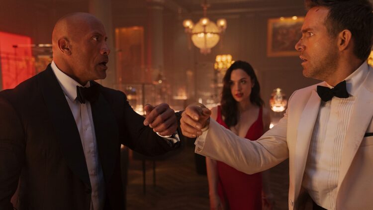 Red Notice Movie Review – Dwayne Johnson, Ryan Reynolds & Gal Gadot Can ...